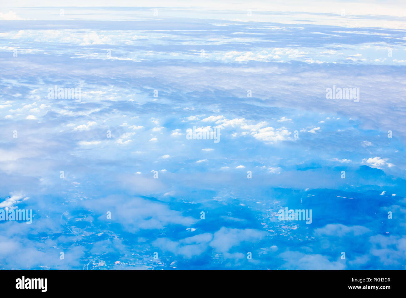 Aerial birds eye view above clouds of the blue sky Stock Photo - Alamy