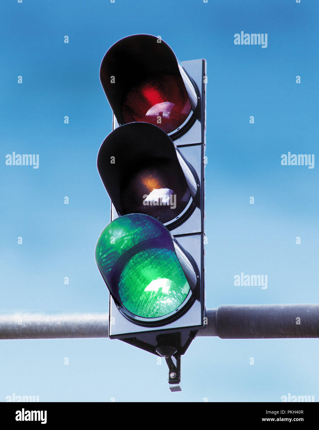 A green traffic light in blue sky Stock Photo - Alamy