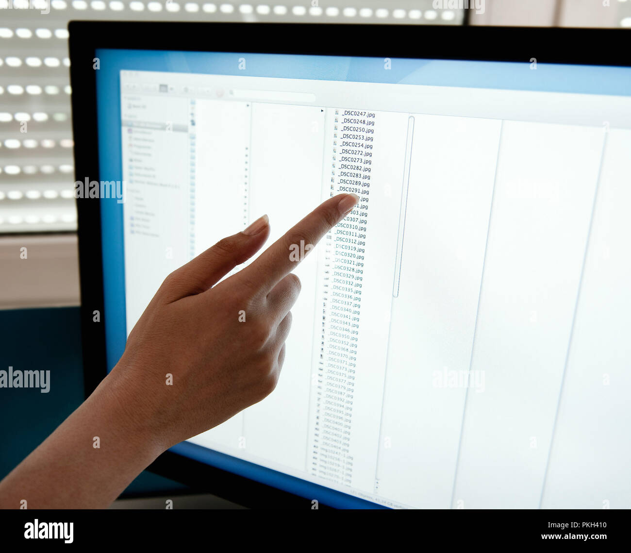 An index finger pointing at monitor Stock Photo - Alamy