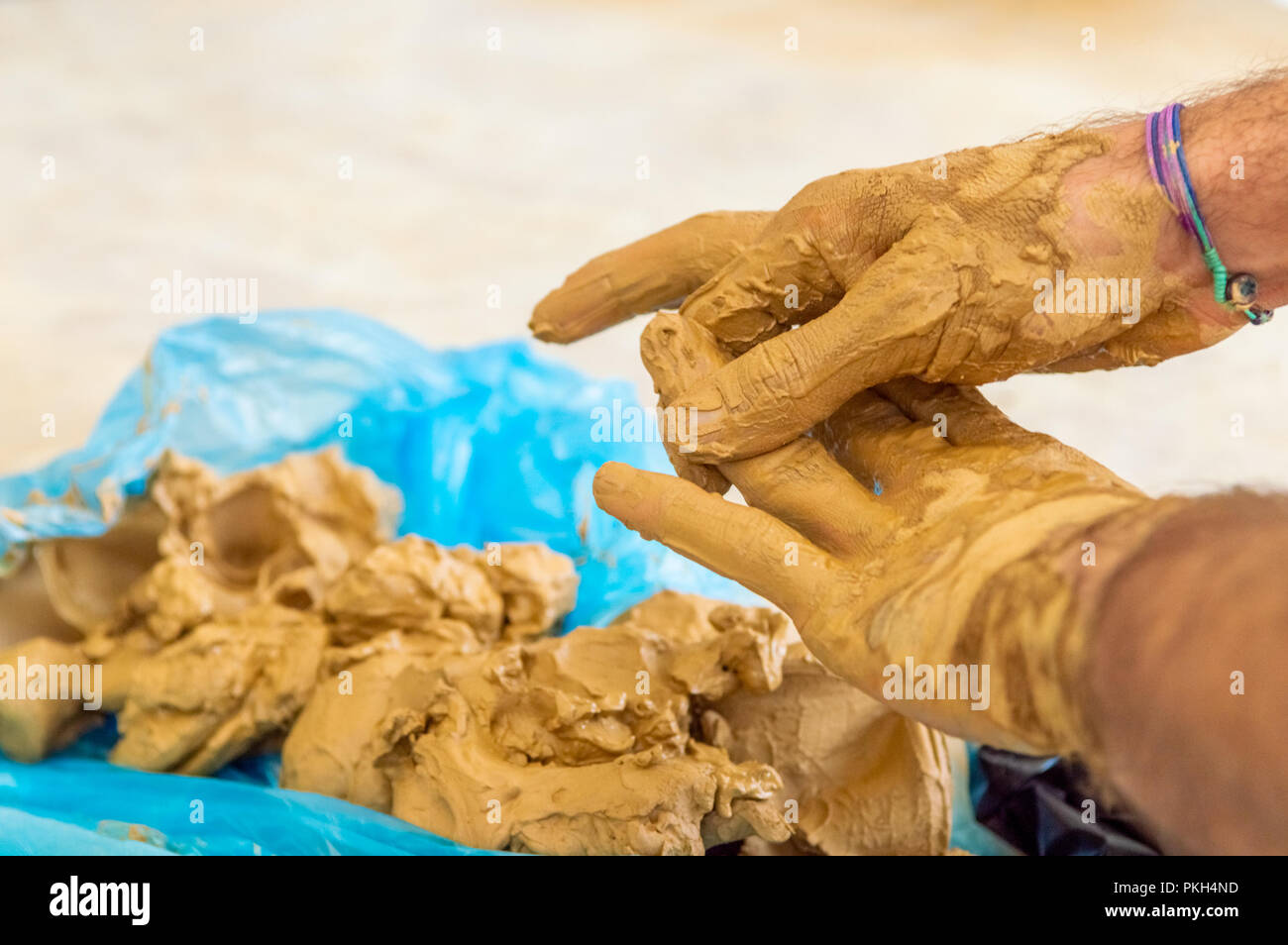 Male artist cleaning clay hi-res stock photography and images - Alamy