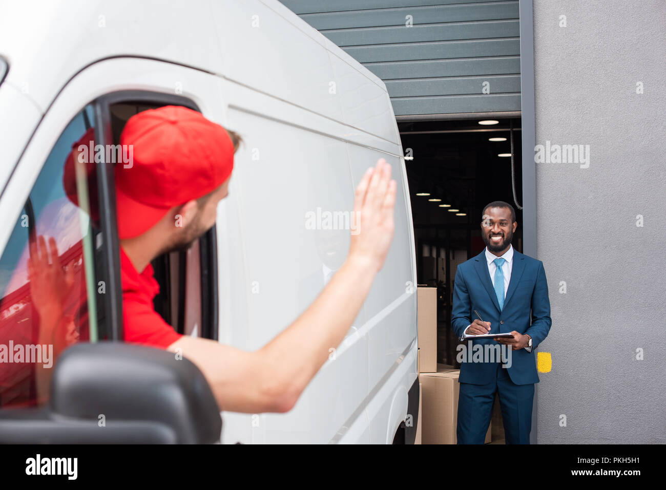 Delivery man in van hi-res stock photography and images - Alamy