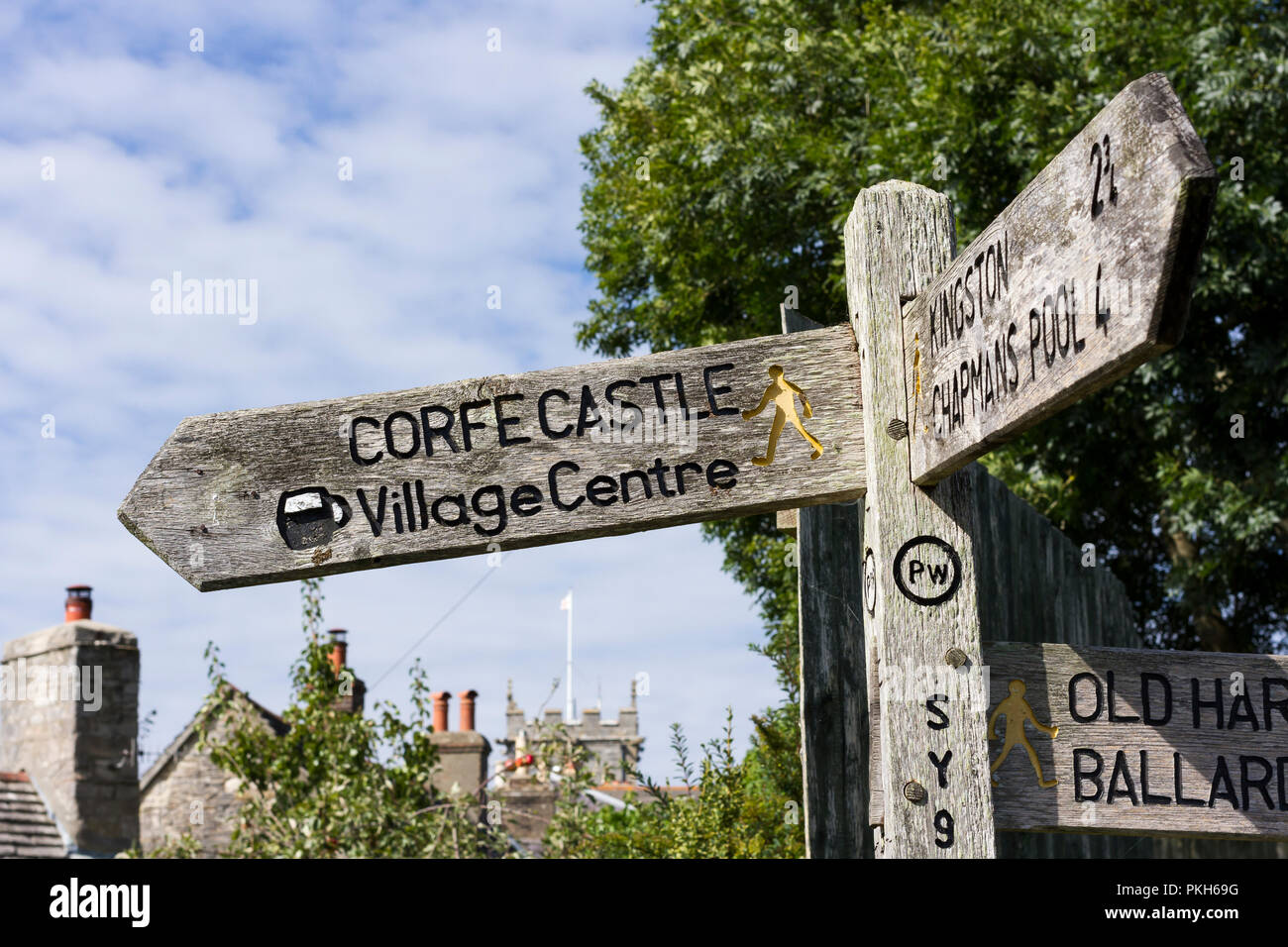 Wooden signpost for Corfe Castle Village Centre, Dorset, UK Stock Photo ...