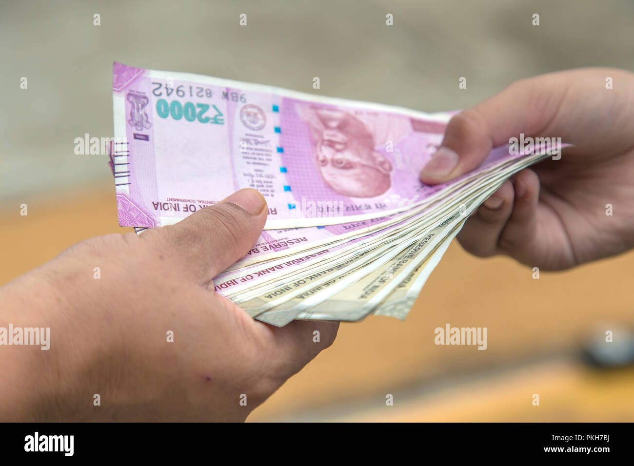 Indian rupees. Holding and giving Indian rupees to someone Stock Photo ...