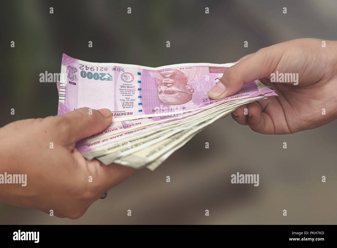 Indian rupees. Holding and giving Indian rupees to someone Stock Photo ...