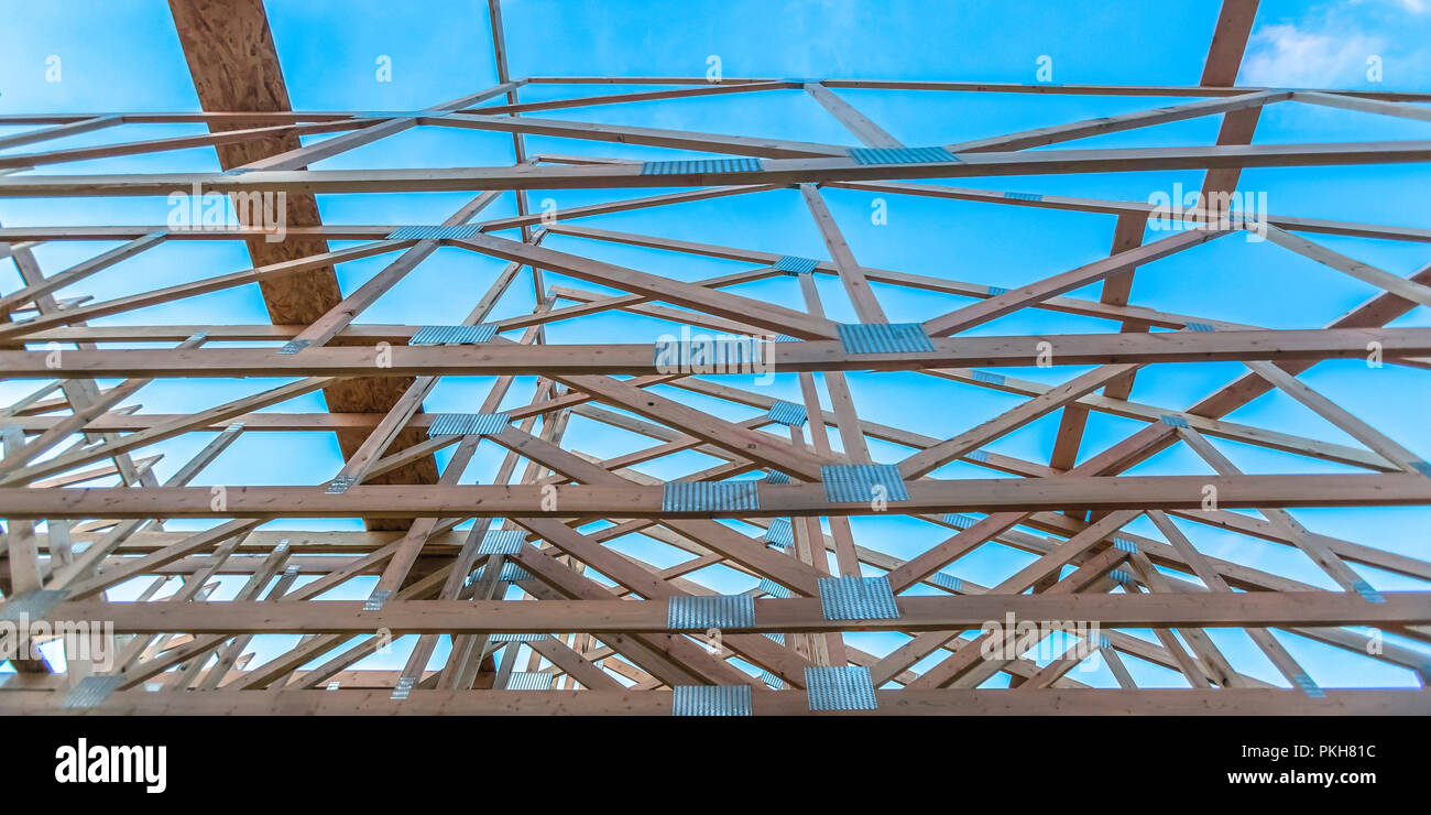 Roof beams of a new wooden construction pano Stock Photo - Alamy
