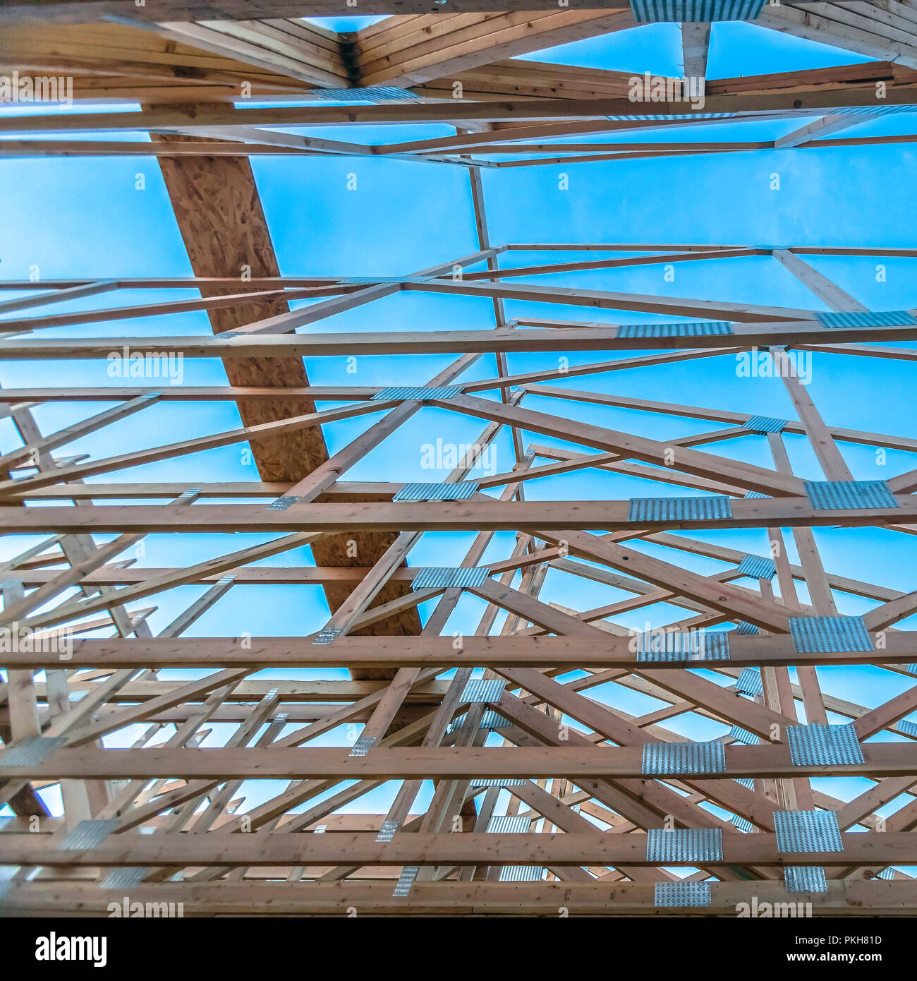 Roof beams of a new wooden construction square Stock Photo - Alamy