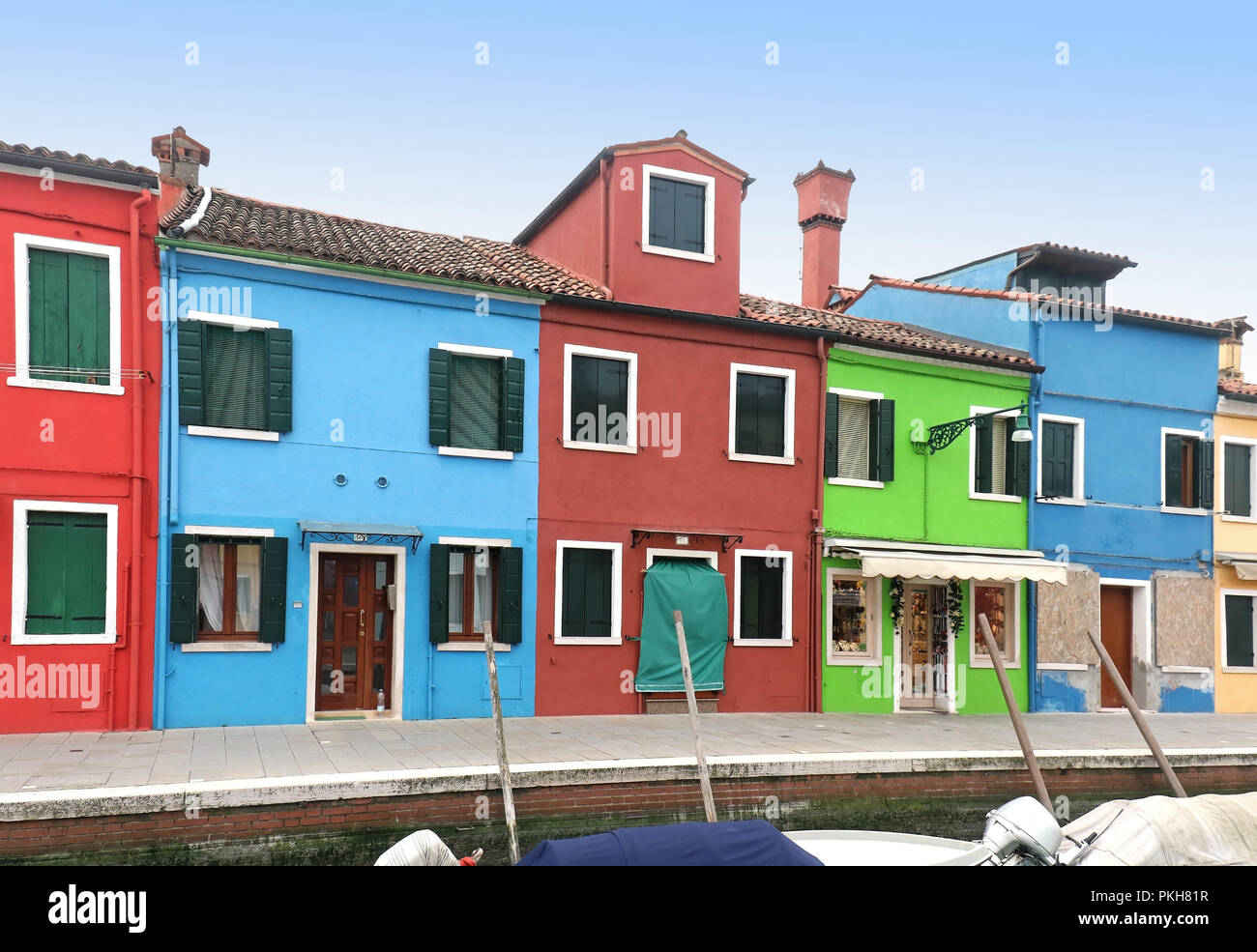 Retro houses with bright color facades on Burano island Stock Photo - Alamy