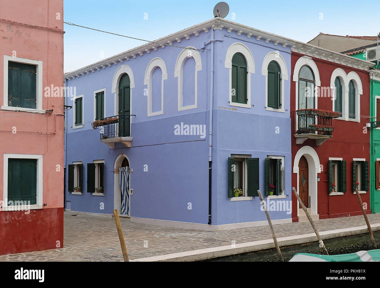 Retro houses with colorful facade walls and closed windows Stock Photo ...