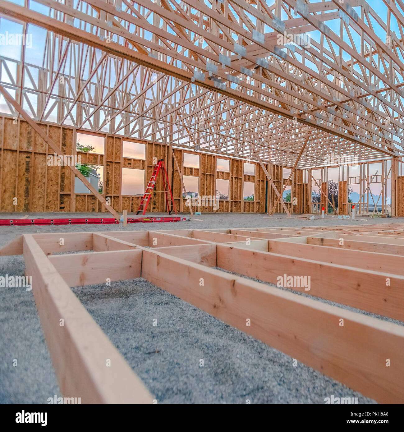 Sand floor and wooden beams in new yard square Stock Photo - Alamy
