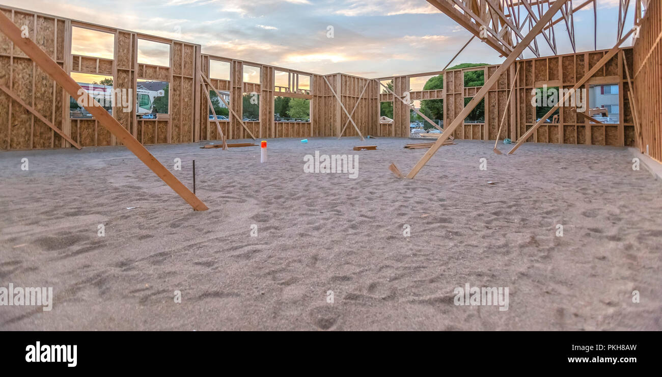 Sand lower wooden beams in new construction pano Stock Photo - Alamy