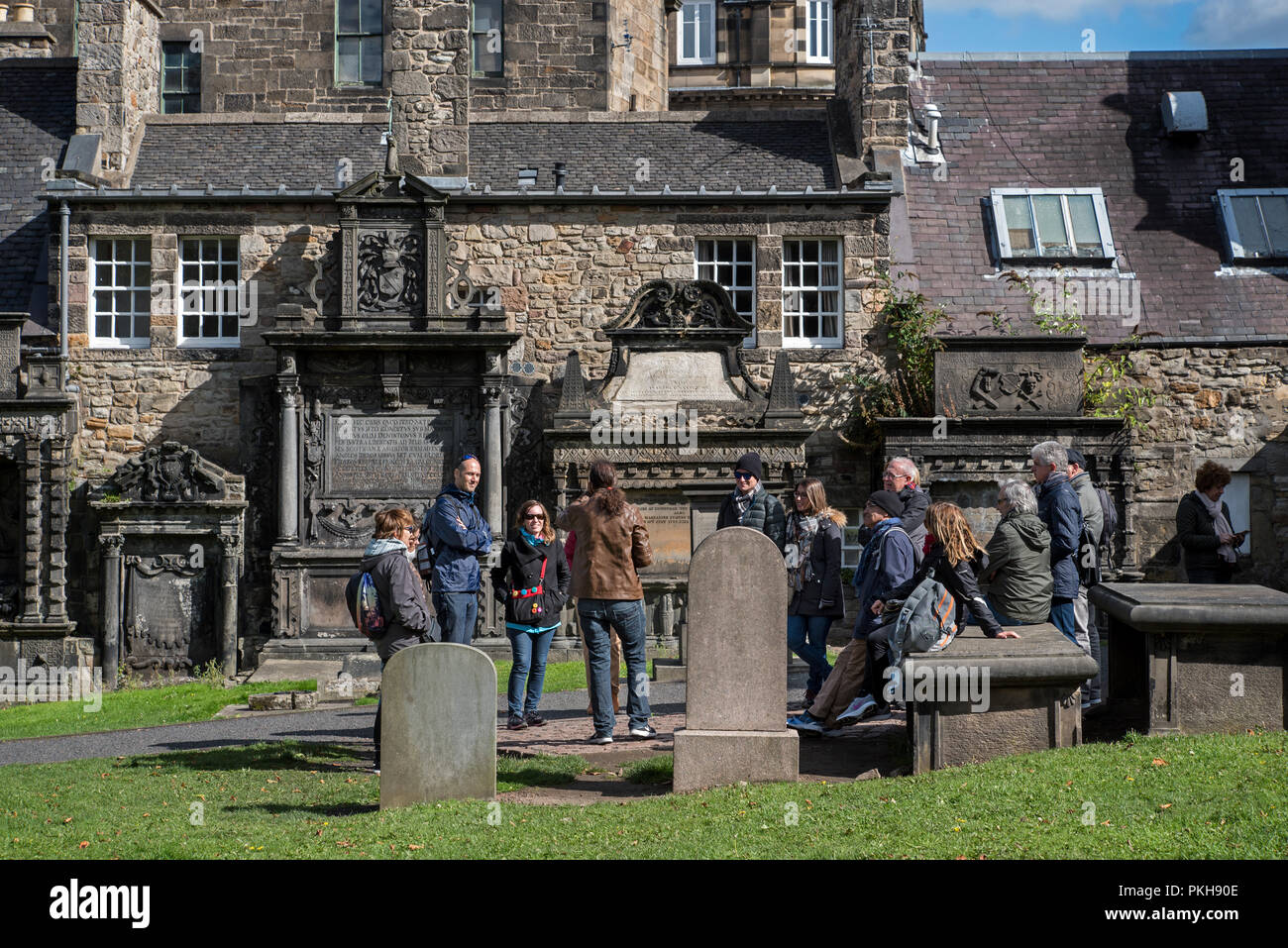 A walking tour stops by the grave of John Gray, the master of Greyfriar ...