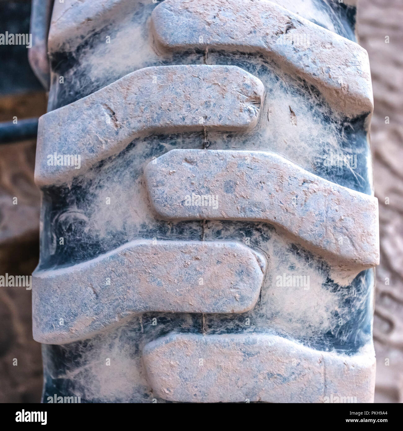 Tread shown on a tire of a tractor square Stock Photo - Alamy
