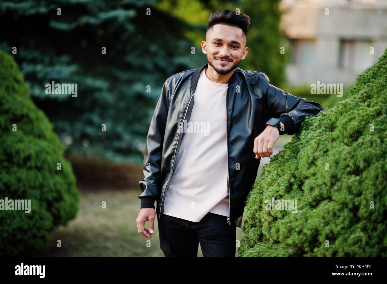 Stylish indian beard man at black leather jacket. India model posed at ...