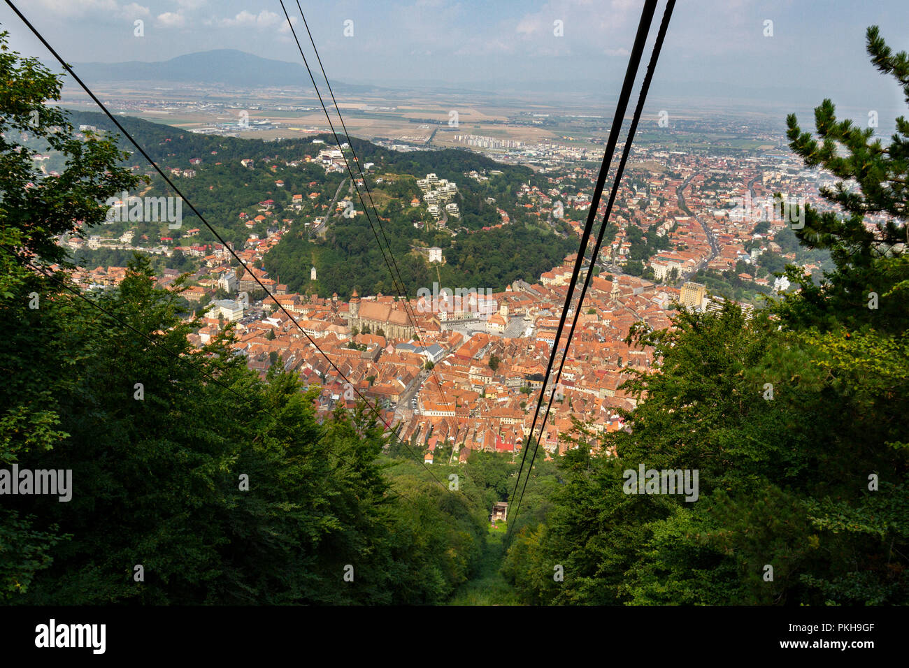 Looking down from the cable car to Mount Tâmpa rising above Brasov ...