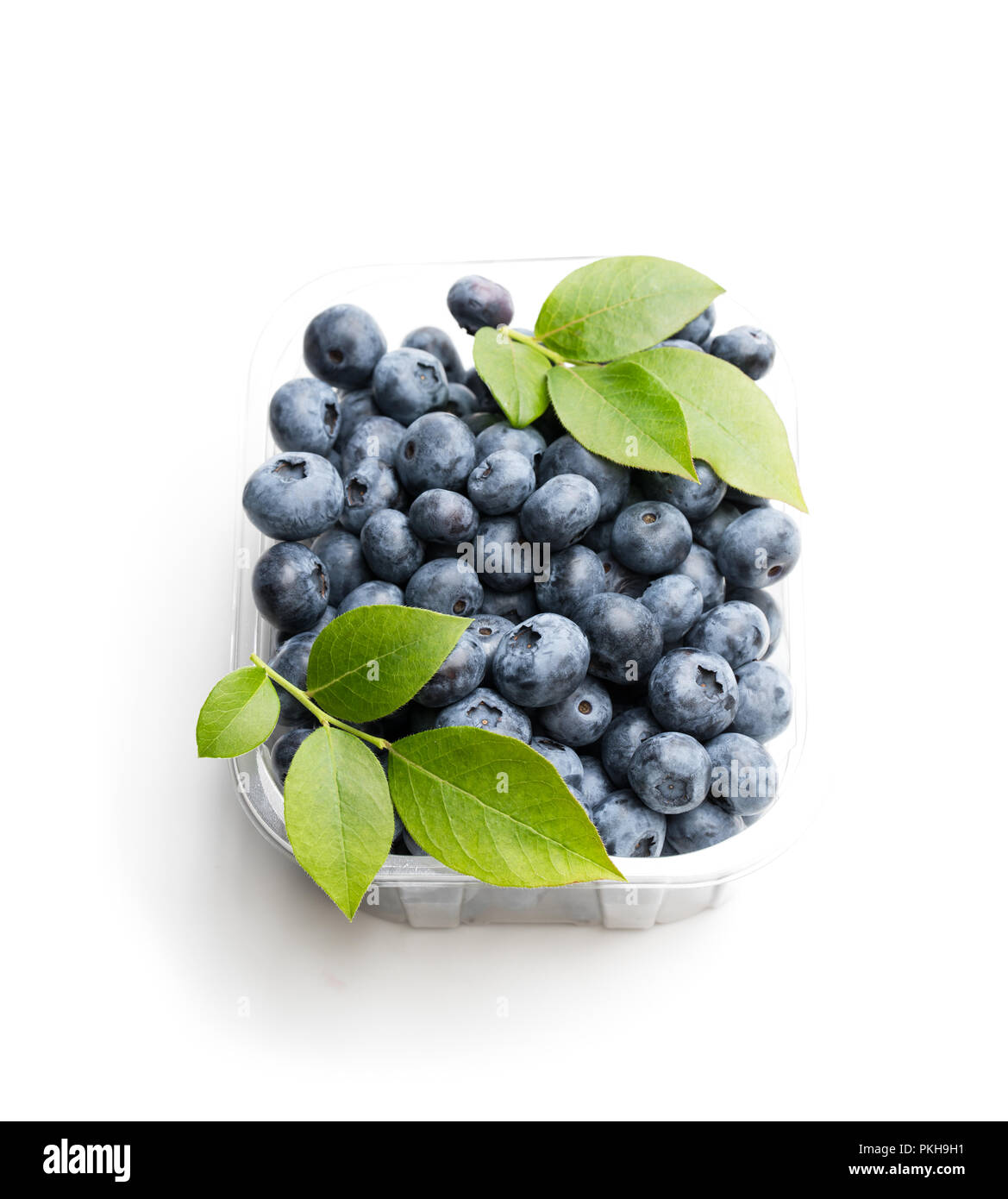 Fresh blueberries in smal plastic container isolated on white Stock ...