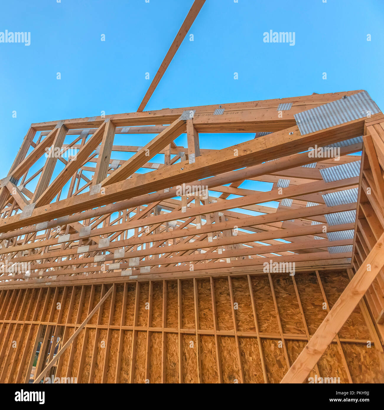 Upper roof area of new constructed building square Stock Photo - Alamy