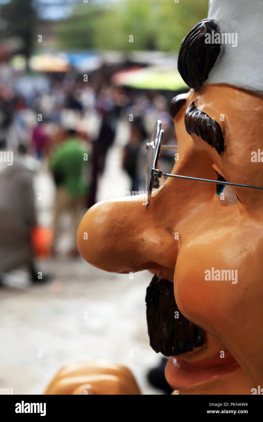 Puppet dressed as a chef at the door of a restaurant in Chefchaouen ...
