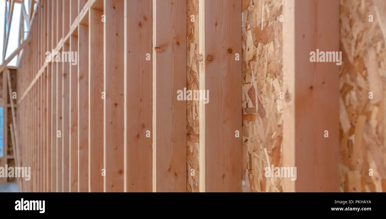 Wall beams with ply wood under construction pano Stock Photo - Alamy