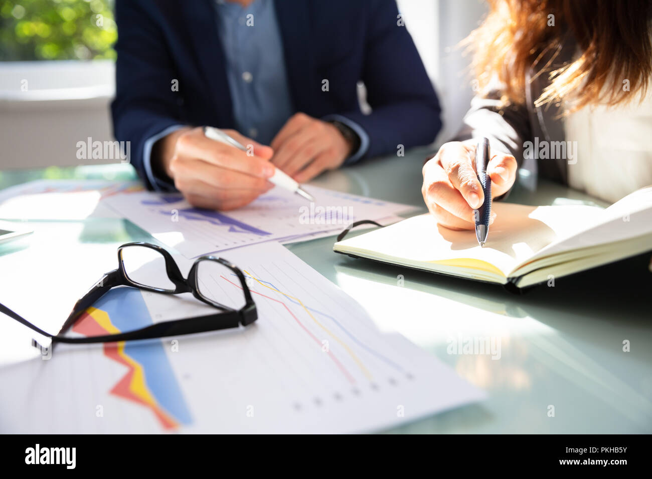 Negotiation man writing on glass hi-res stock photography and images ...