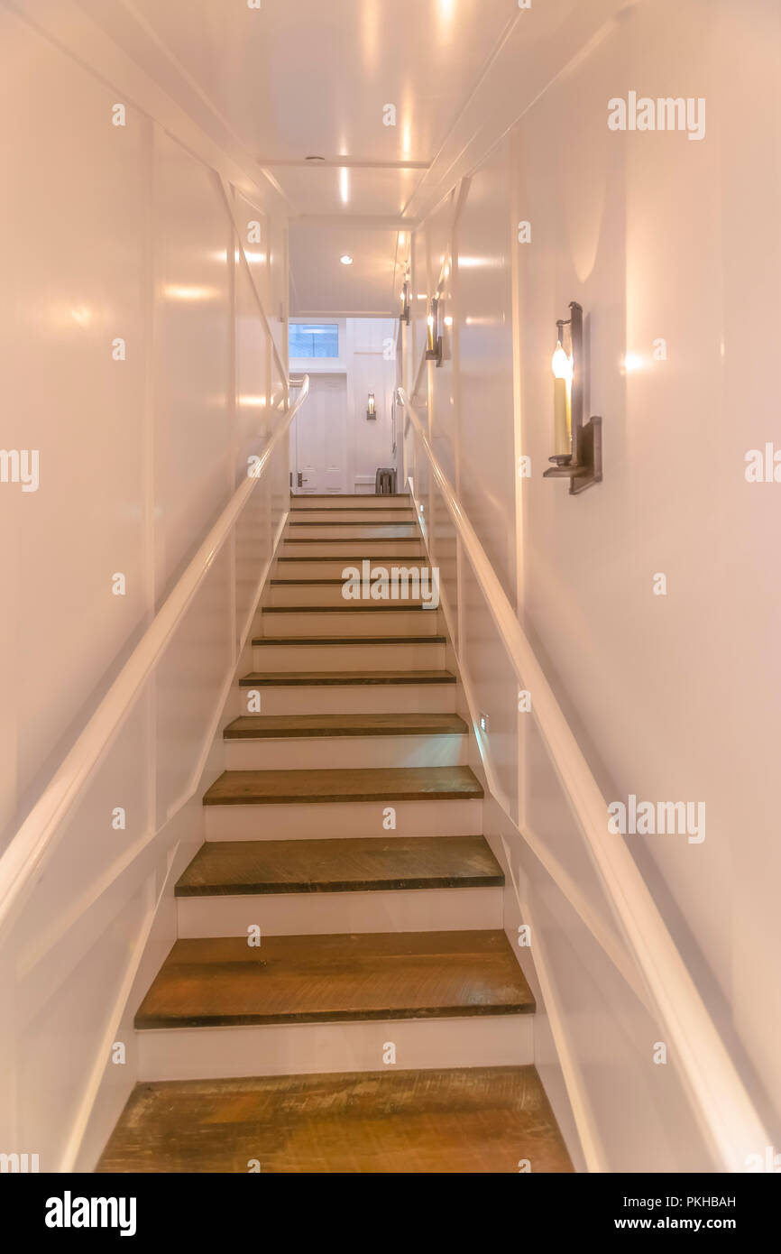 White shiny walls up the stairs in hotel Stock Photo - Alamy