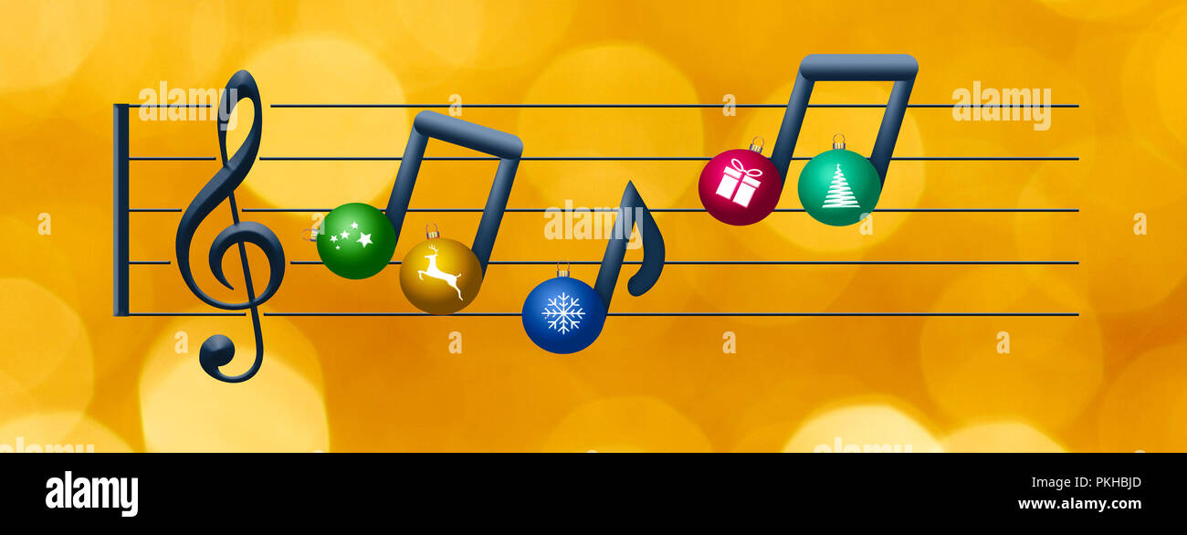 Musical notes made of Christmas ornaments float on a treble clef in ...