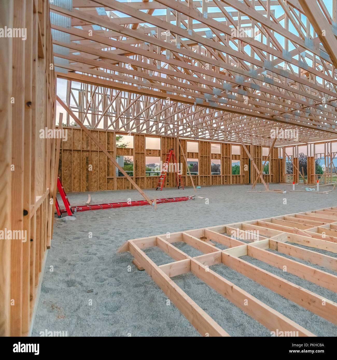Wood beams in a brand new development red ladders Stock Photo - Alamy