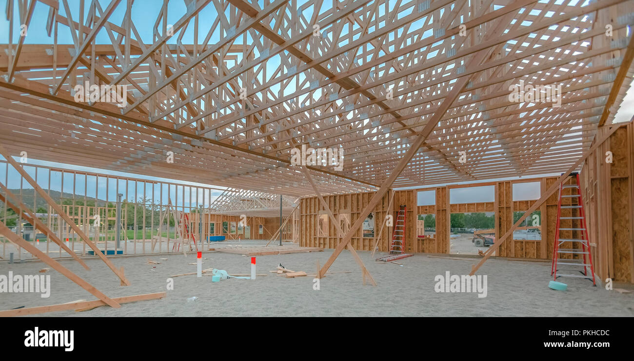 Wooden beams in new building wide angle pano Stock Photo - Alamy