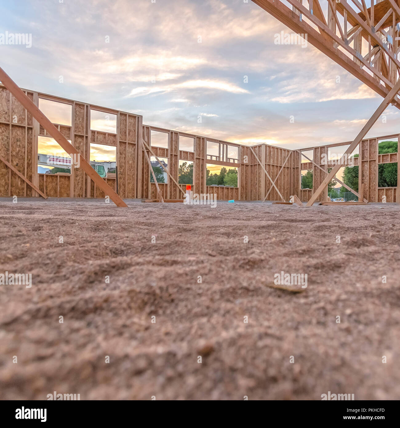 Wooden beams in sand area in building square Stock Photo - Alamy