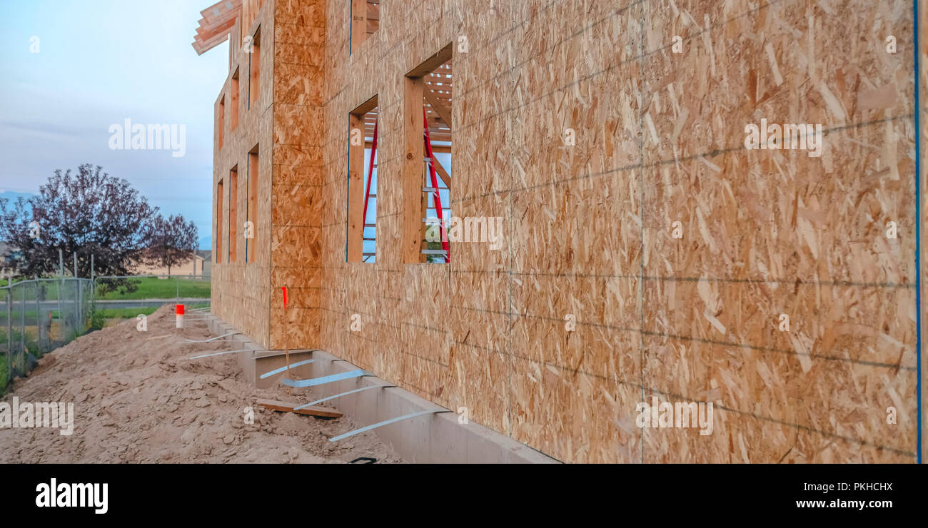 Wooden boards of a new construct building pano Stock Photo - Alamy