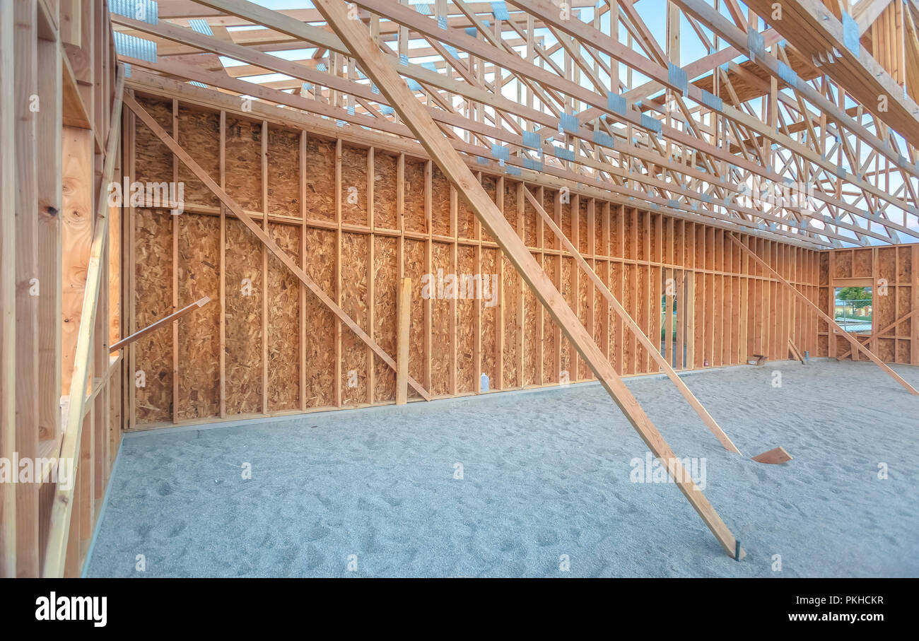 Wooden construction of building in sand pit Stock Photo - Alamy