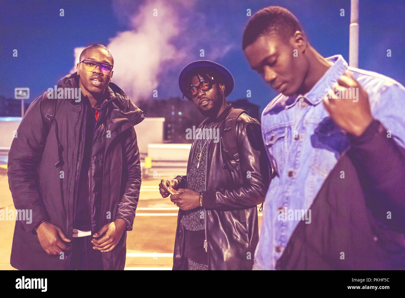 three young men posing outdoor looking camera serious - rap crew, gang ...