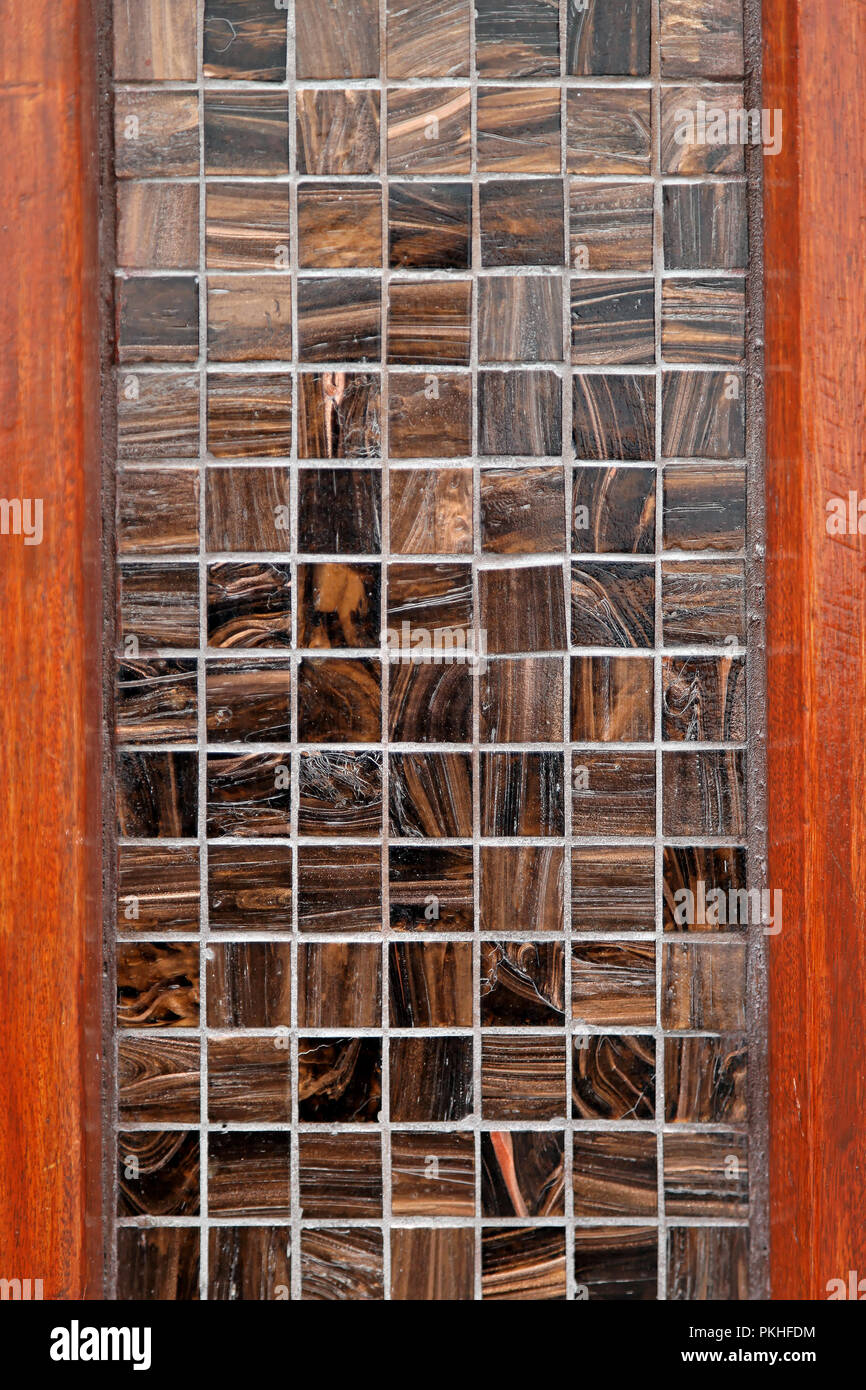 Small square mosaic tiles made from brown marble Stock Photo - Alamy