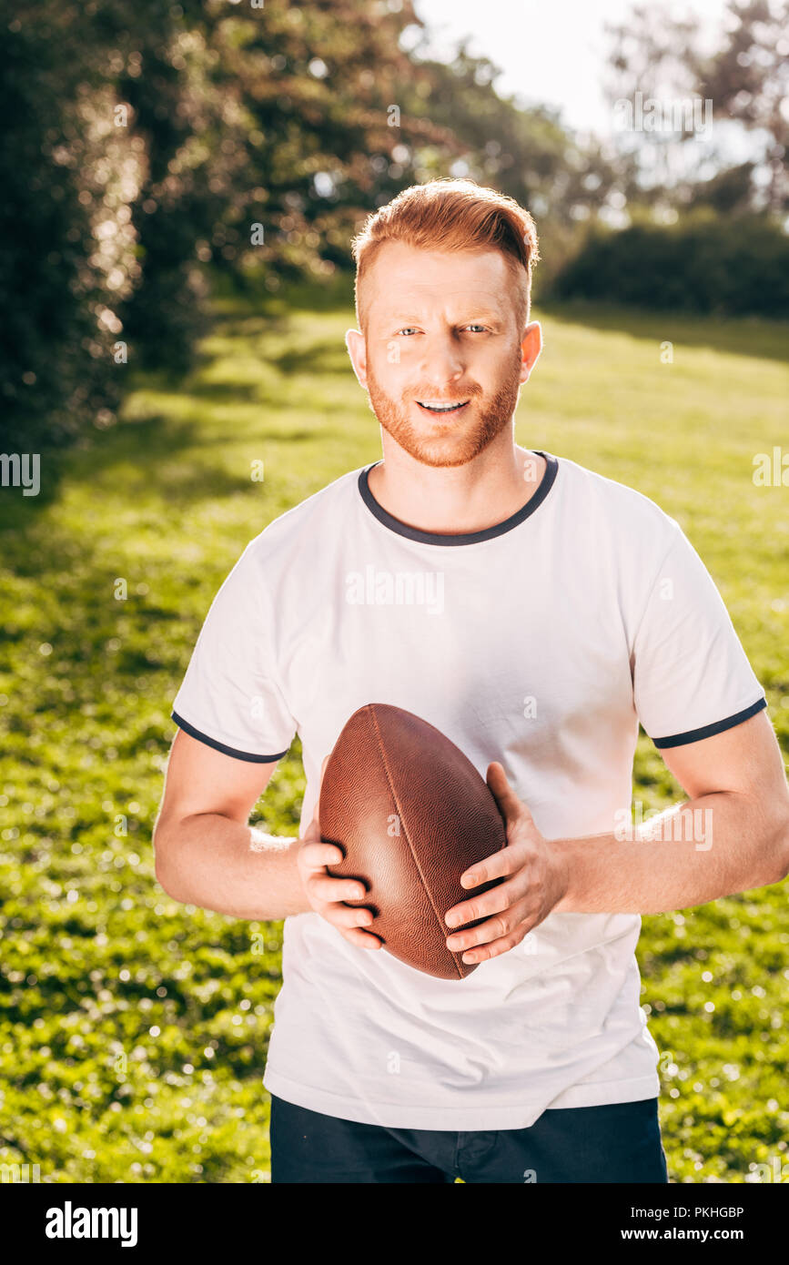 Holding rugby ball hi-res stock photography and images - Alamy