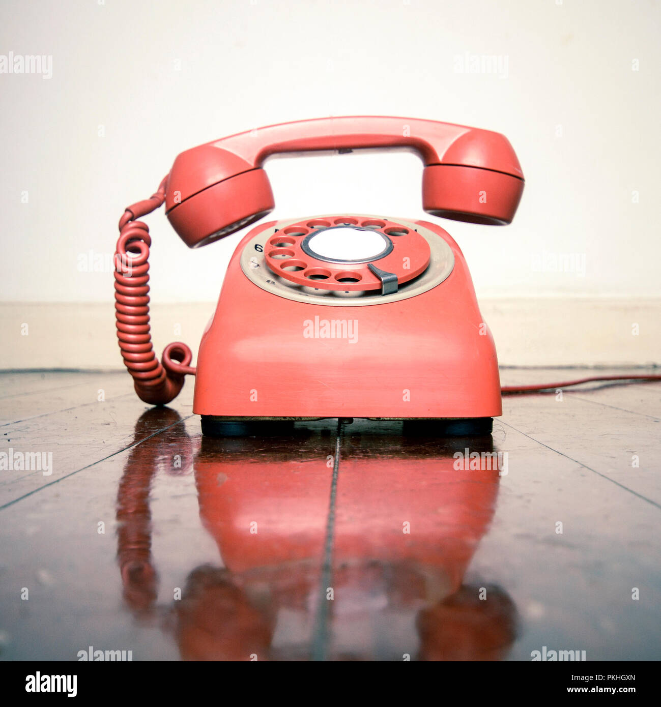 retro phone ringing on a old wooden floor with reflection Stock Photo ...