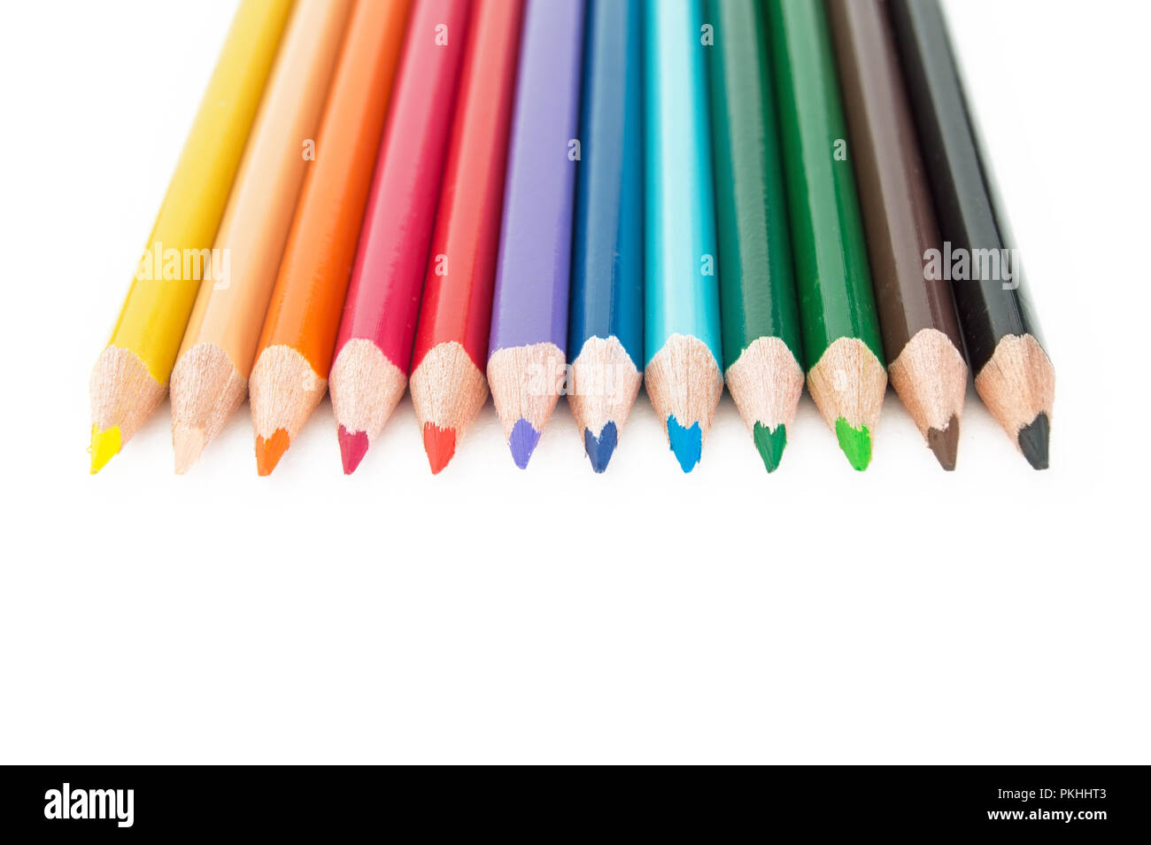 A row of colored pencils on a white background Stock Photo - Alamy