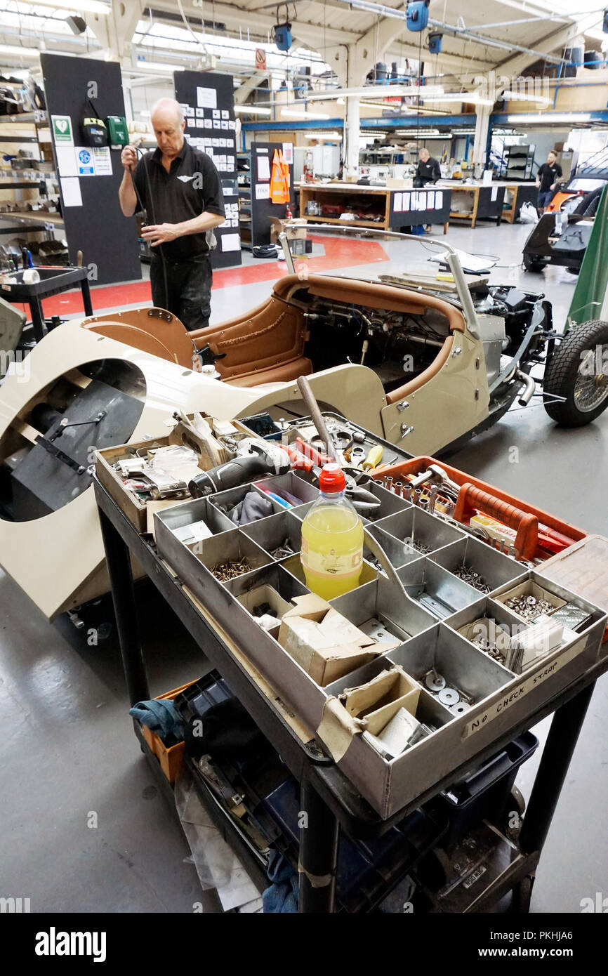 engineers assembling Morgan sports car at Morgan manufacturing plant ...