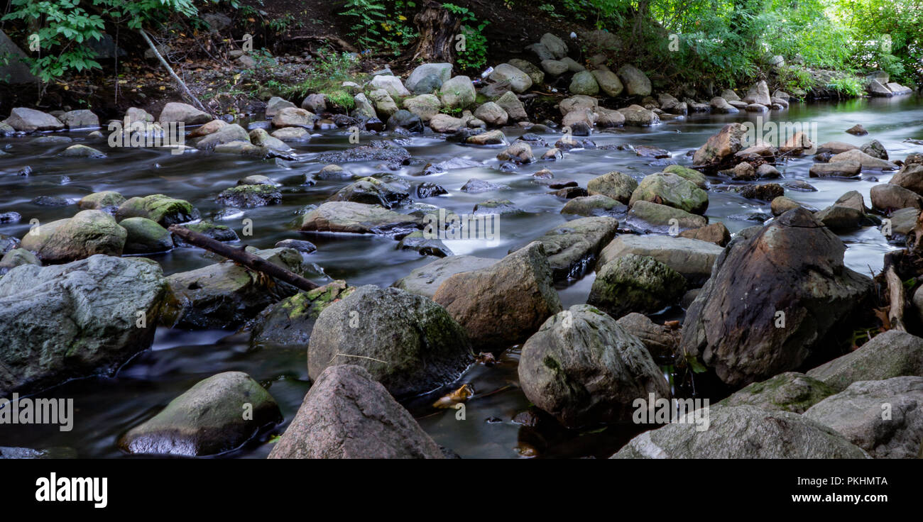 silky water scene landscape stream connecting to a river with colorful ...