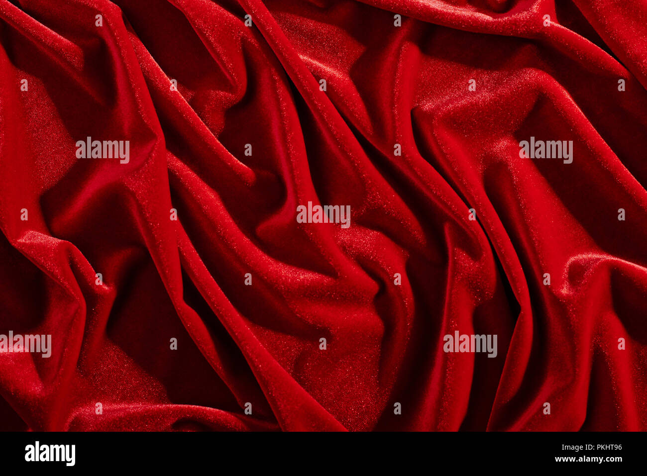 Red color velvet textiles for background or texture, wrinkled and ...