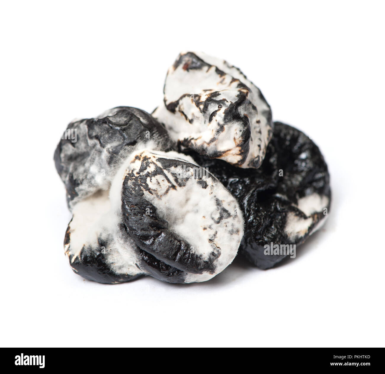 Rotten prunes with mold isolated on white background Stock Photo - Alamy