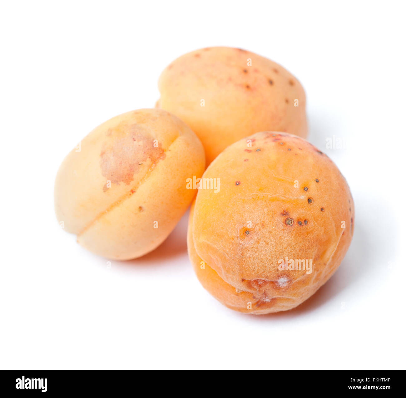 Rotten apricots with mold isolated on white background Stock Photo - Alamy