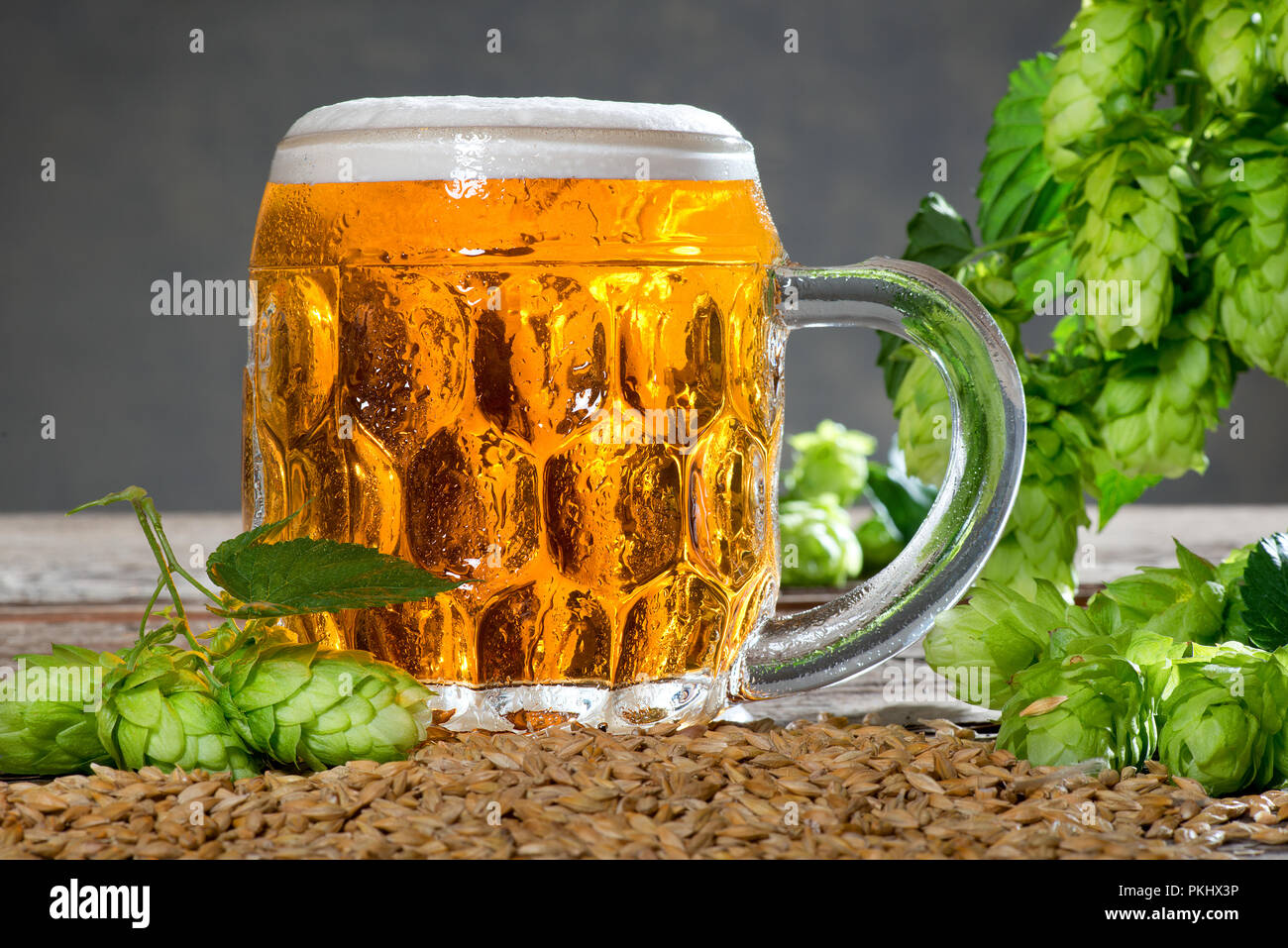 Beer glass and raw material for beer production Stock Photo - Alamy