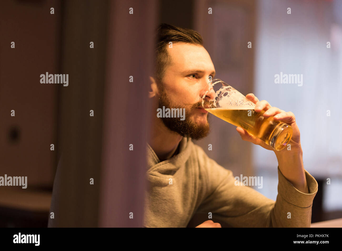 Man with a moustache and a pint of beer hi-res stock photography and ...