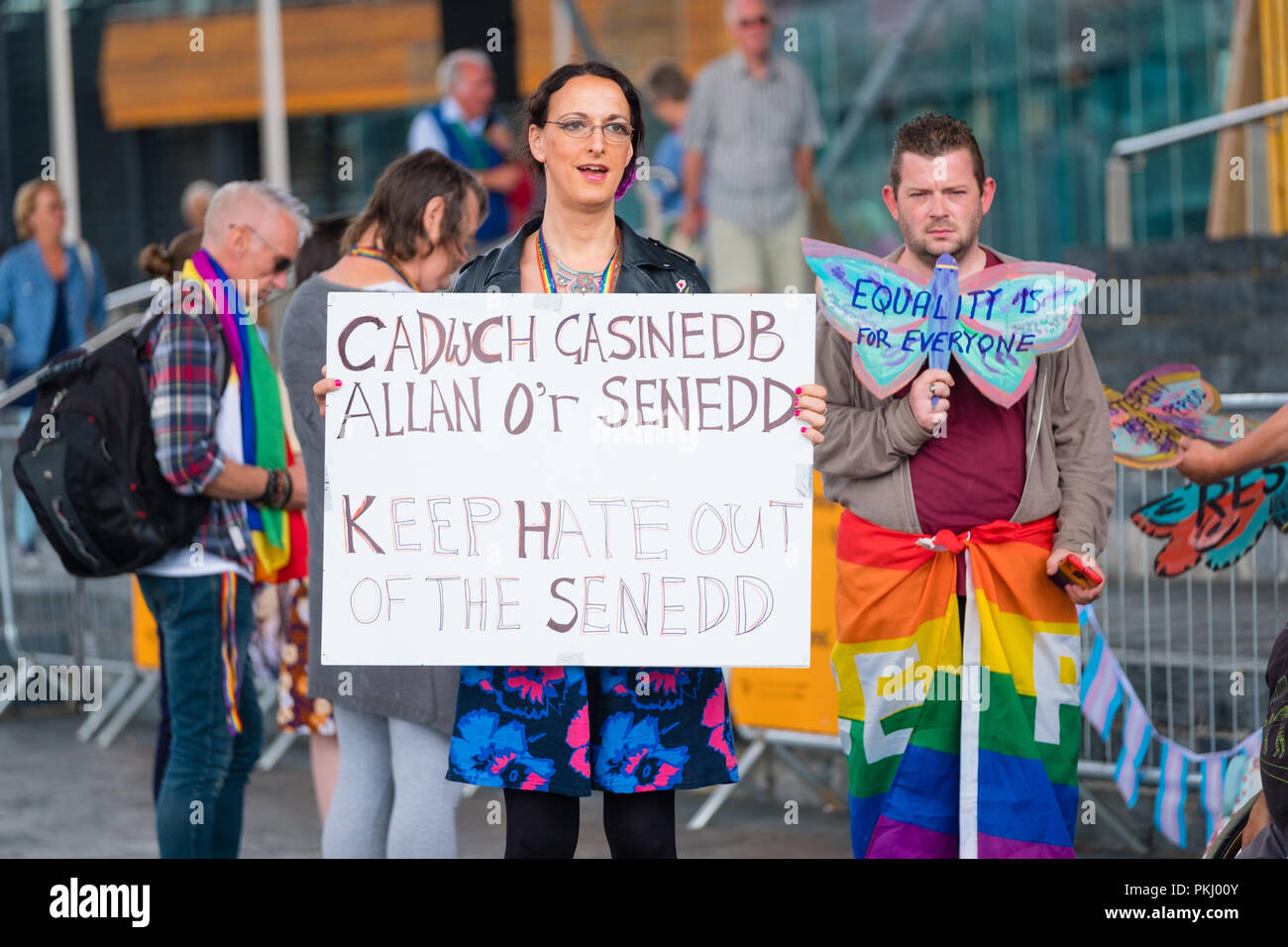 "Keep hate out of the senedd", protesters holding bilingual welsh and ...