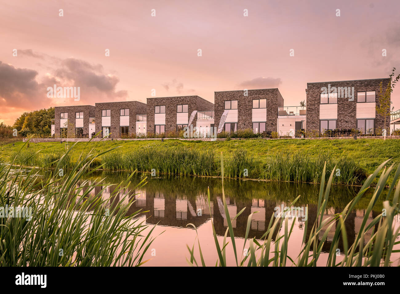 A futuristic housing projekt on the bank of a man-made river ...