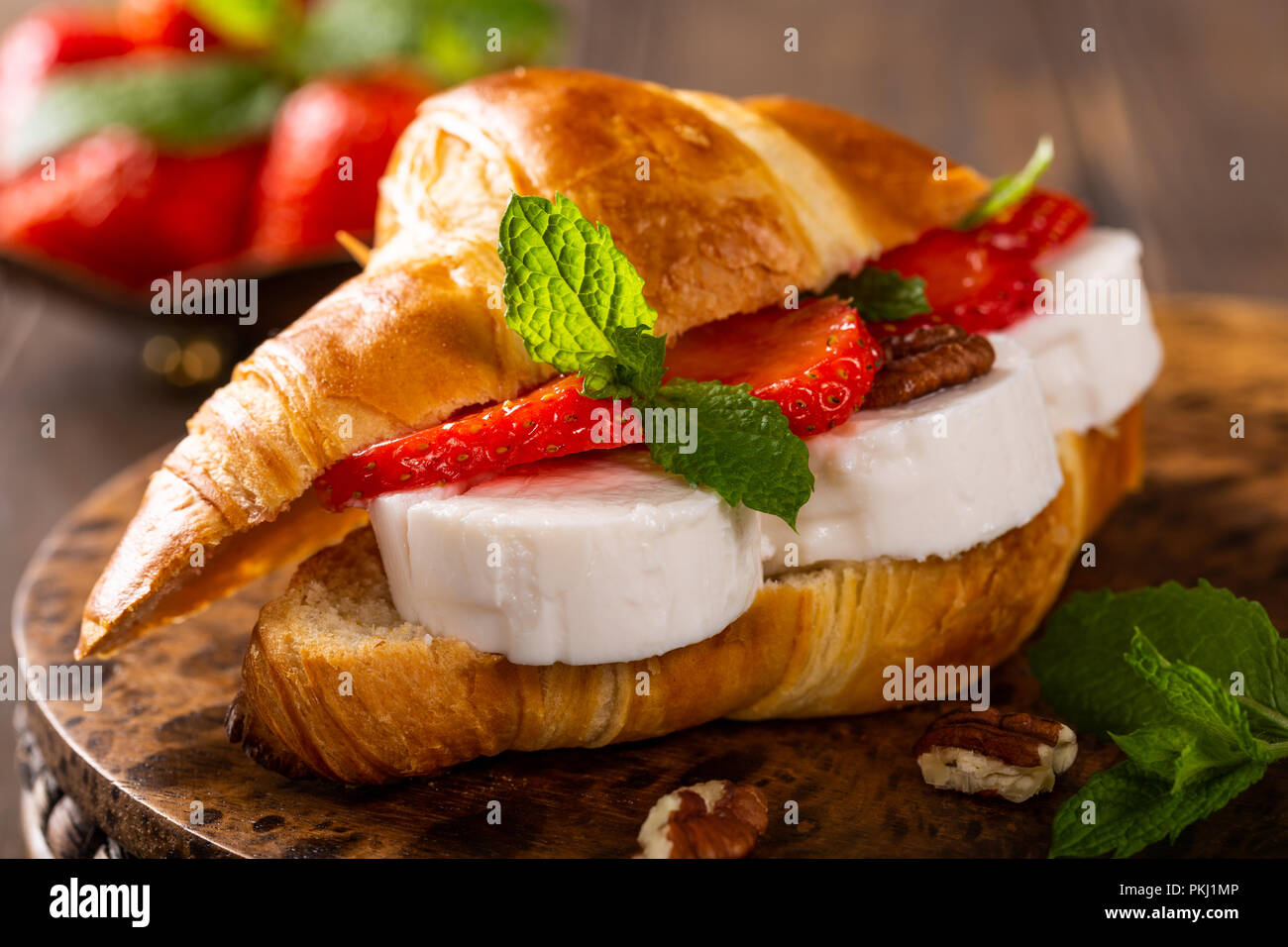 Sandwich croissant with goat cheese Stock Photo - Alamy