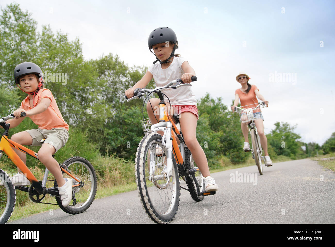 Happy adults children bicycles hi-res stock photography and images - Alamy