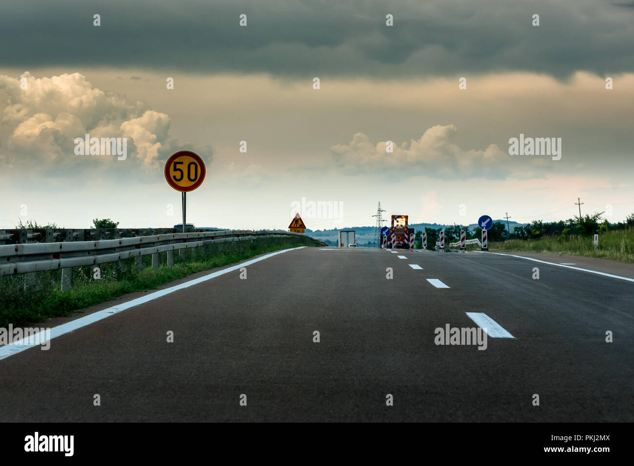 Highway constriction due to road repair with light traffic Stock Photo ...