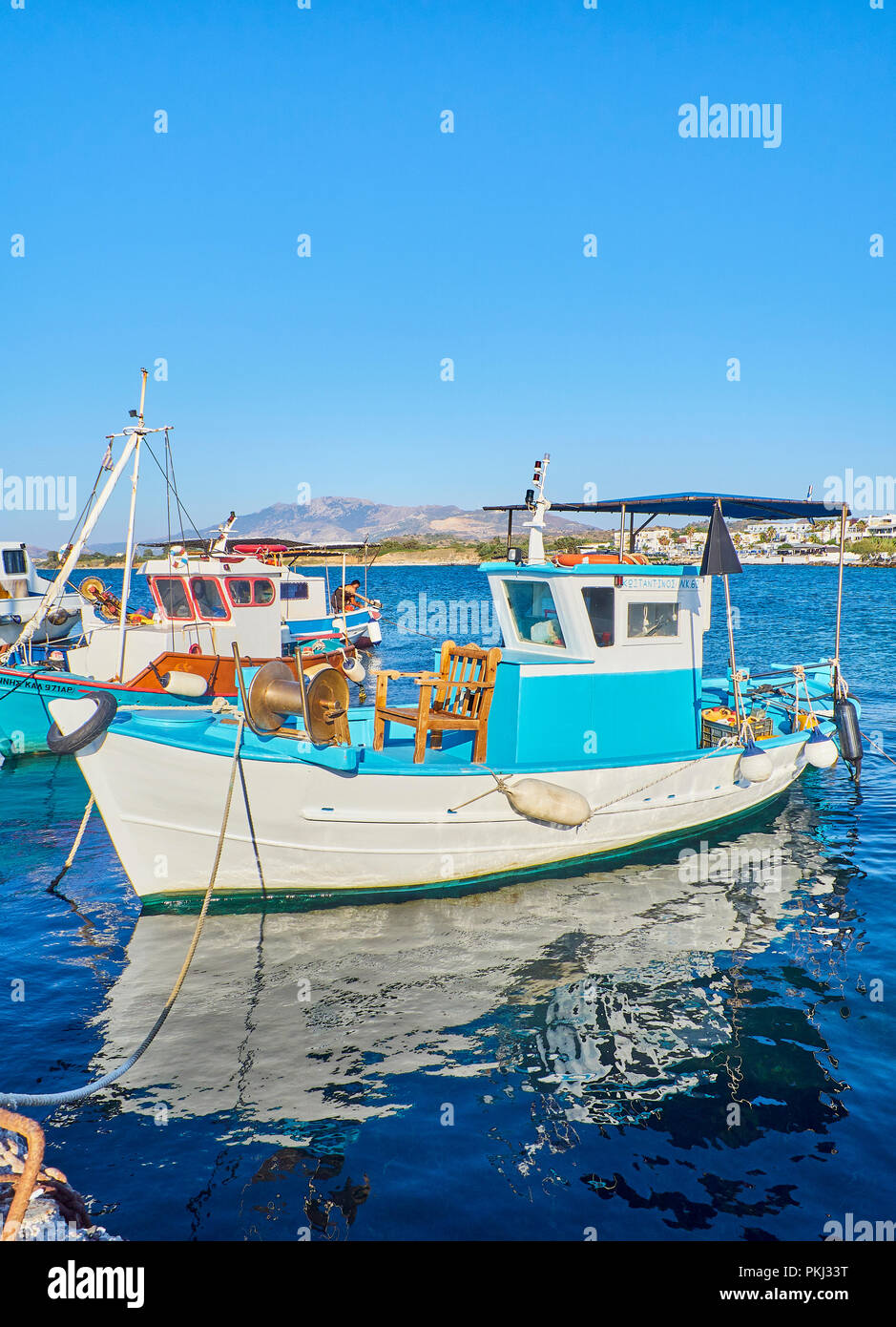 Greek fishing boats moored in Mastichari fishing port, a village of ...