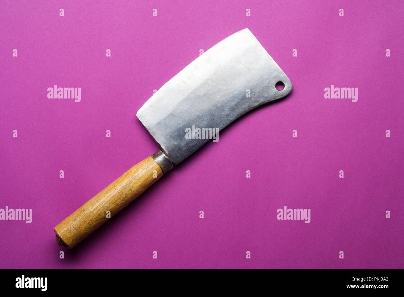Vintage butcher meat on pink paper background with copy space Stock ...