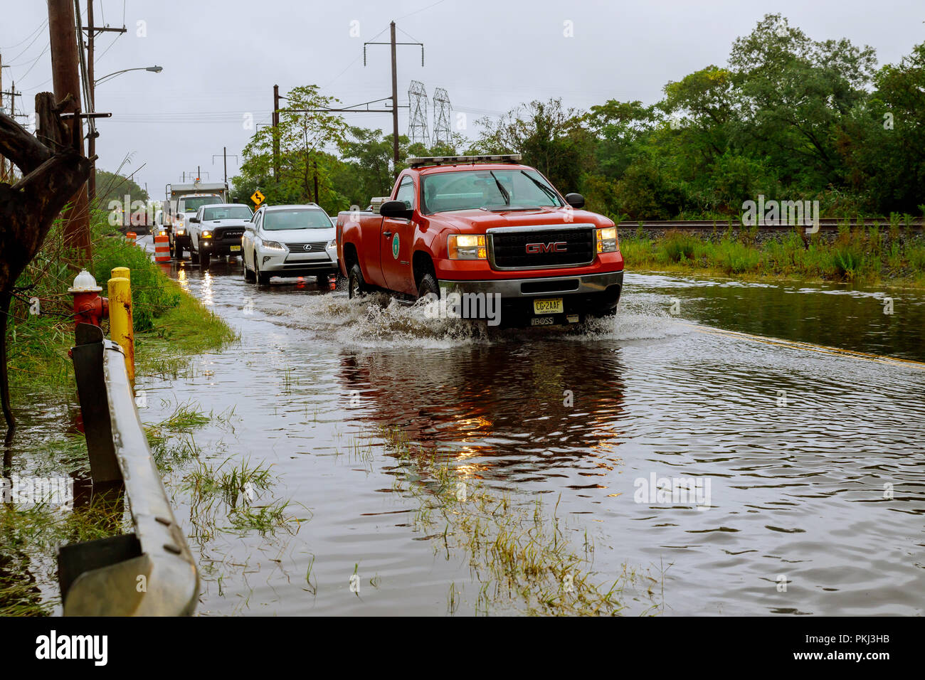 Cars on the street flooded with rain flood road cars on the road Stock ...